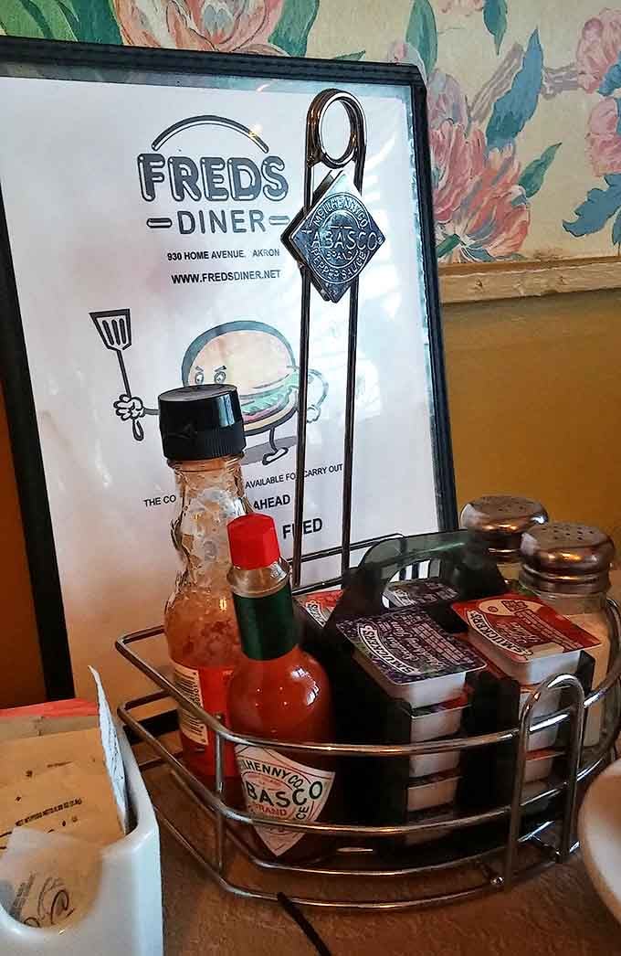 The condiment caddy &ndash; that essential diner table centerpiece where hot sauce dreams and ketchup fantasies come together in perfect harmony.