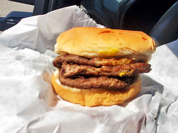 The triple burger&mdash;for when you've had a day that only serious beef therapy can fix. Three patties of griddle-kissed perfection that would make any cardiologist nervous.