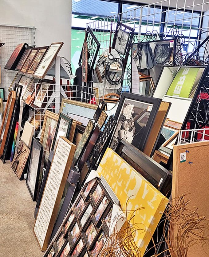 Wall art leans in chaotic splendor, like a gallery where mid-century modern meets dorm room chic. Your perfect statement piece is hiding here somewhere.