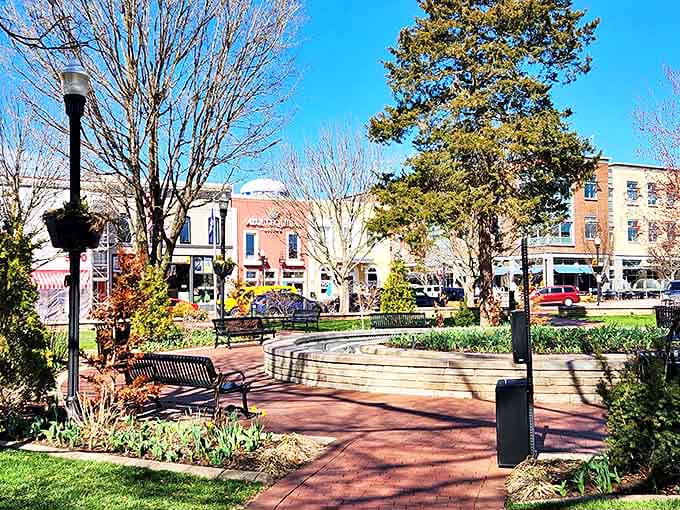 Bentonville's town square blooms with seasonal color, offering benches where locals and visitors alike pause to enjoy the heartbeat of this charming community.