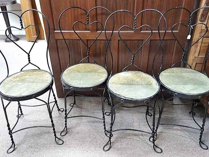 Ice cream parlor chairs with hearts that have witnessed countless first dates. Imagine the teenage romances that blossomed while sitting in these!