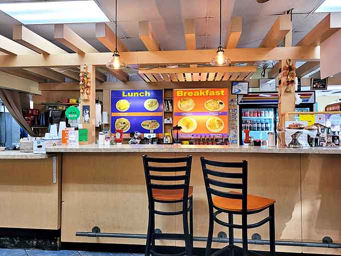 The counter view&mdash;where solo diners find community and the breakfast-versus-lunch debate plays out on illuminated menu boards.