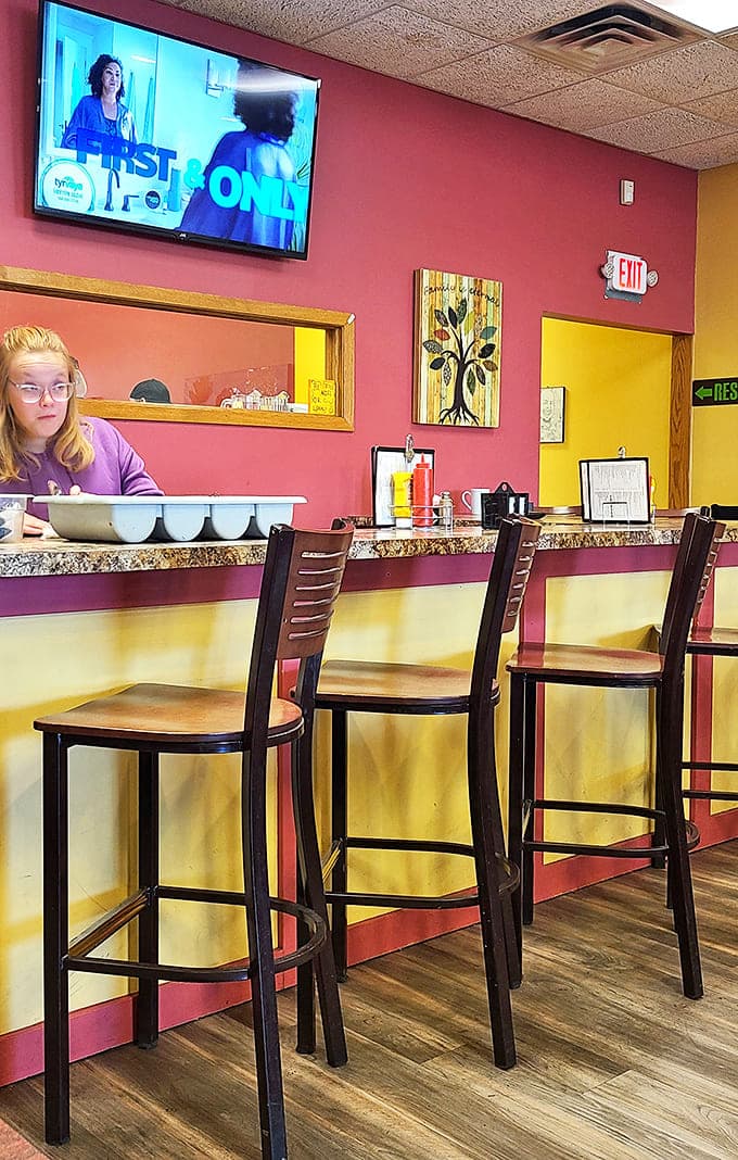 The counter seating offers front-row tickets to the breakfast show, where coffee refills appear like magic and friendly banter is always on the menu.