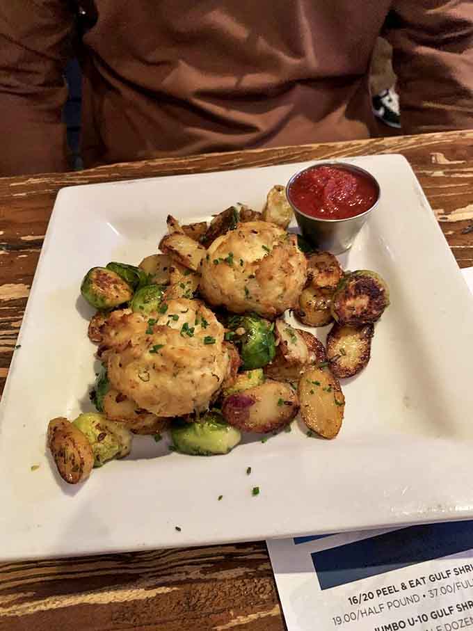 Crab cakes that are actually crab&mdash;revolutionary concept!&mdash;served with roasted potatoes and Brussels sprouts that refuse to be mere side characters.