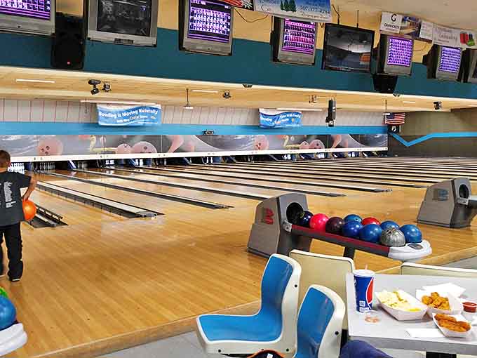 Holiday Lanes offers that timeless combination of fluorescent lighting, rental shoes, and the satisfying crash of pins that no video game has ever replicated.