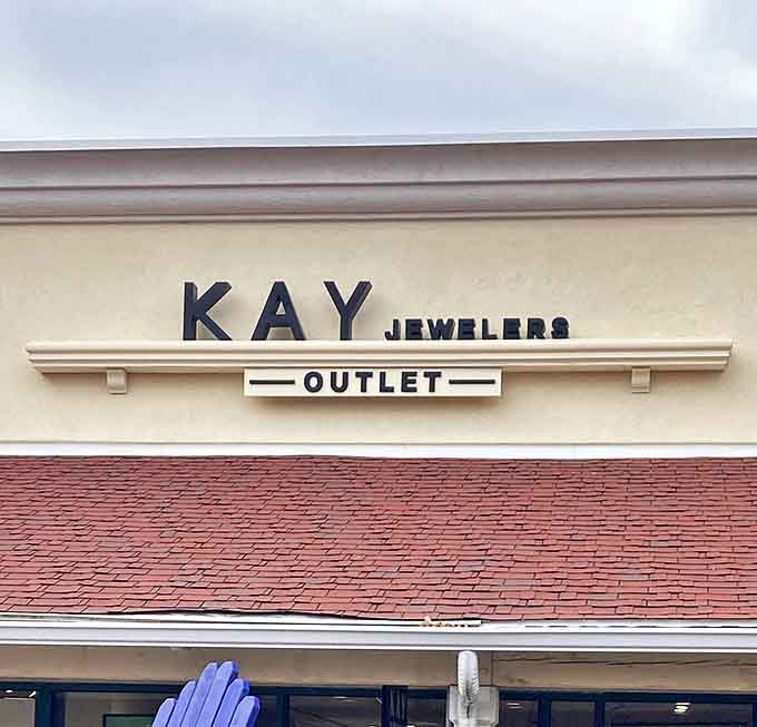 Kay Jewelers Outlet&mdash;where even discounted diamonds still sparkle with the promise of special occasions or spectacular apologies. That clean, classic signage hints at treasures within.