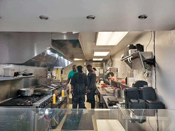 The kitchen&mdash;where the magic happens behind the scenes. Those flames aren't just cooking food; they're creating edible joy that keeps people coming back.