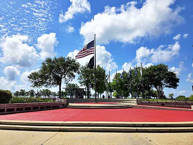 Veterans Memorial Park stands as a solemn yet beautiful tribute, where American flags snap in the Gulf breeze and history deserves our quiet respect.