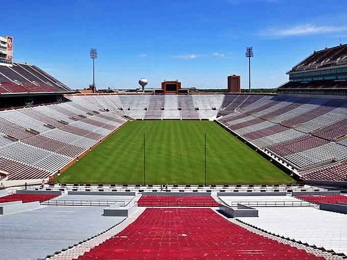 OU's Gaylord Family Oklahoma Memorial Stadium sits quietly between game days, but don't be fooled—those empty seats hold thunderous memories.