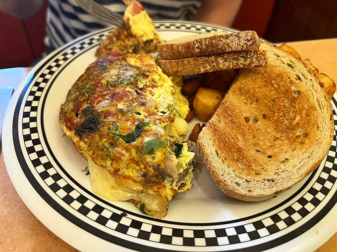 An omelet that contains multitudes&mdash;vegetables, cheese, and eggs in perfect harmony. The toast stands ready for the supporting role of a lifetime.