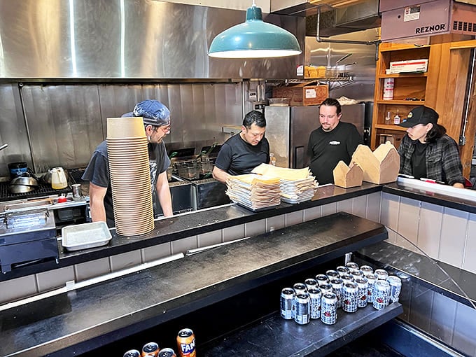 Where the magic happens! The kitchen crew moves with the choreographed precision of people who know exactly what they're doing&mdash;making our taste buds dance.