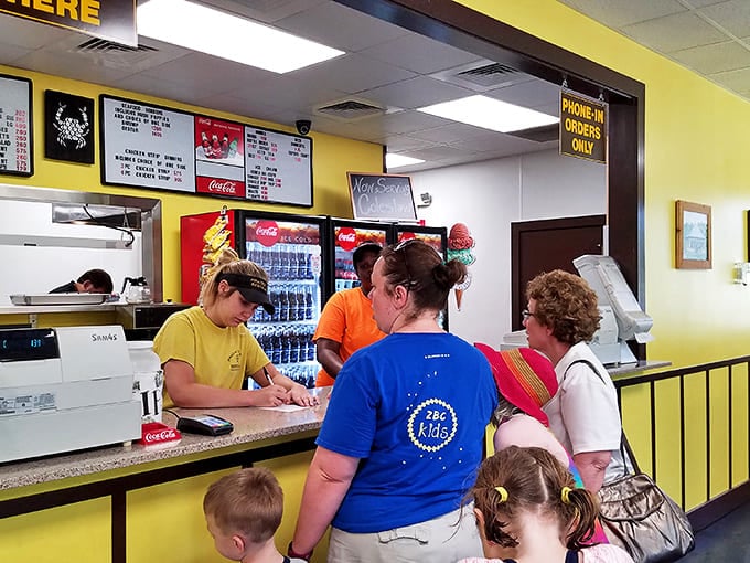 The order counter buzzes with activity as hungry patrons line up for their chance at po'boy perfection.