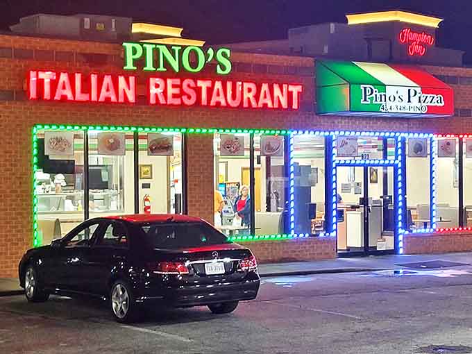 Pino's Pizza glows like a neon-trimmed beacon for late-night hunger, when nothing but Italian comfort food will do.