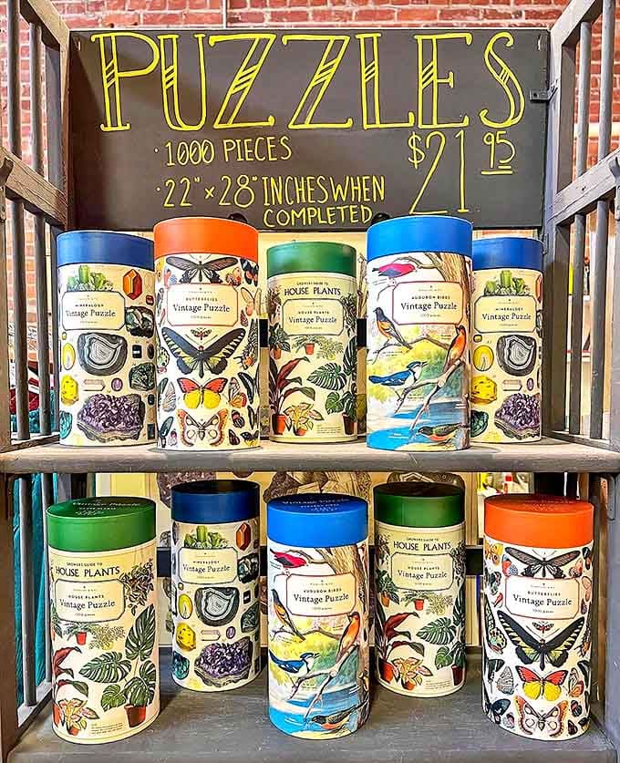 Puzzles that once consumed family weekends now wait patiently in their cylindrical homes for new tables to occupy.