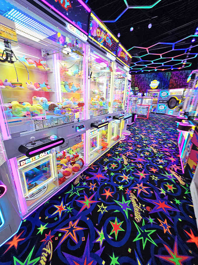The arcade area offers a neon-lit respite for shopping-weary companions who've reached their retail therapy limit.