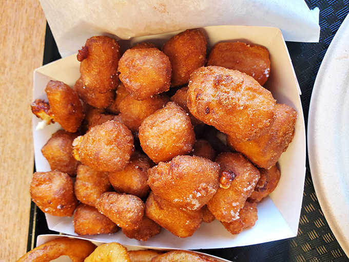 These golden tater tots aren't just fried potatoes&mdash;they're little nuggets of happiness that crunch like childhood memories between your teeth.