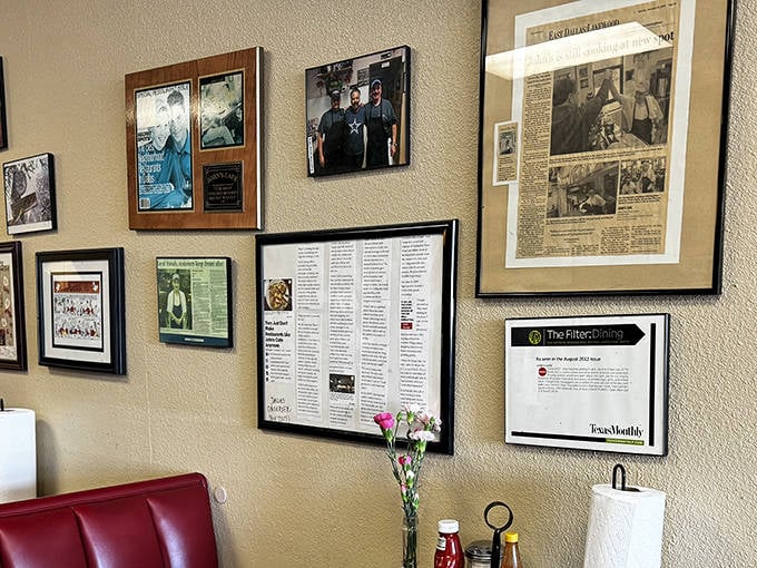 The wall of fame tells stories of satisfied customers, media recognition, and community connections. Each frame holds a chapter in John's Cafe history.