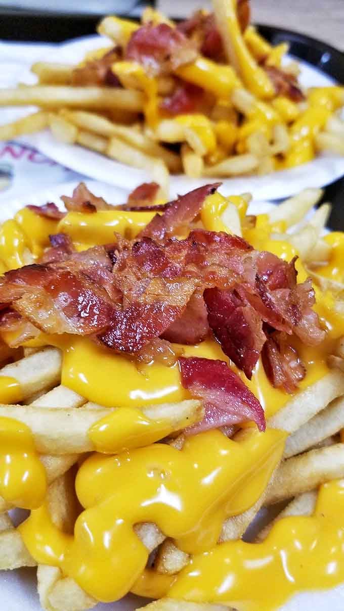 Bacon cheese fries aren't just a side dish here&mdash;they're a religious experience. Golden, gooey, and graced with perfectly crispy bacon bits.