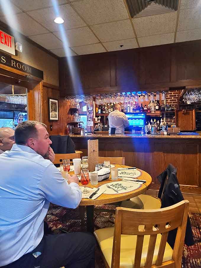 The bar at Twin Oaks isn't just where drinks are poured; it's where strangers become friends and Cranston solves the world's problems.