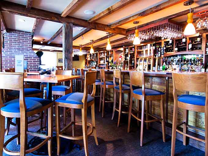 The bar at Buckley's isn't just where drinks are served—it's where stories begin, with wooden stools that have heard it all.