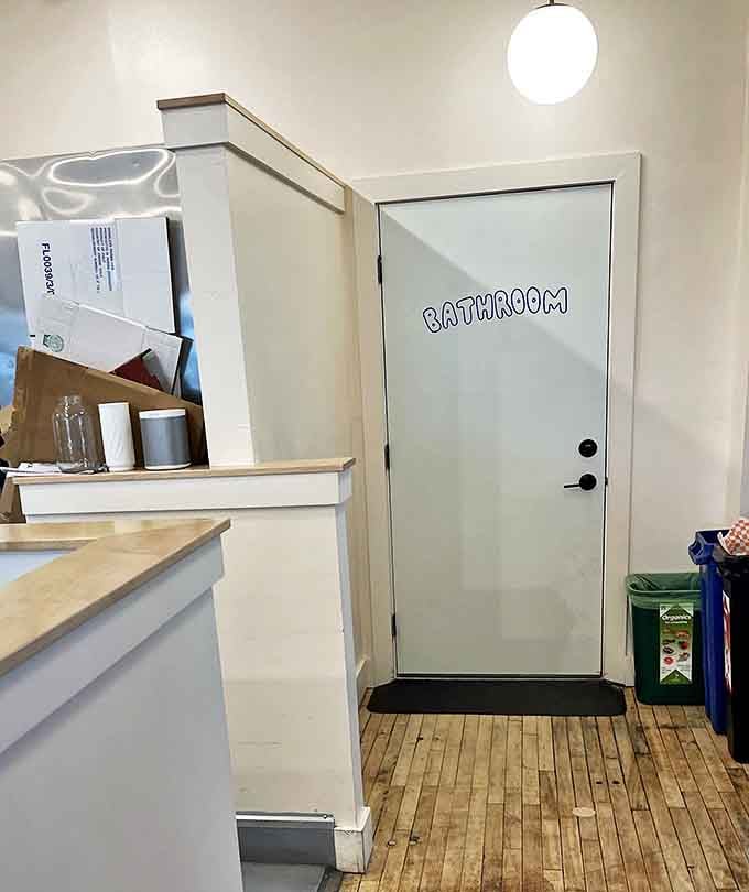 Even the bathroom sign has personality. In the land of serious sandwiches, playful touches remind you not to take life too seriously.