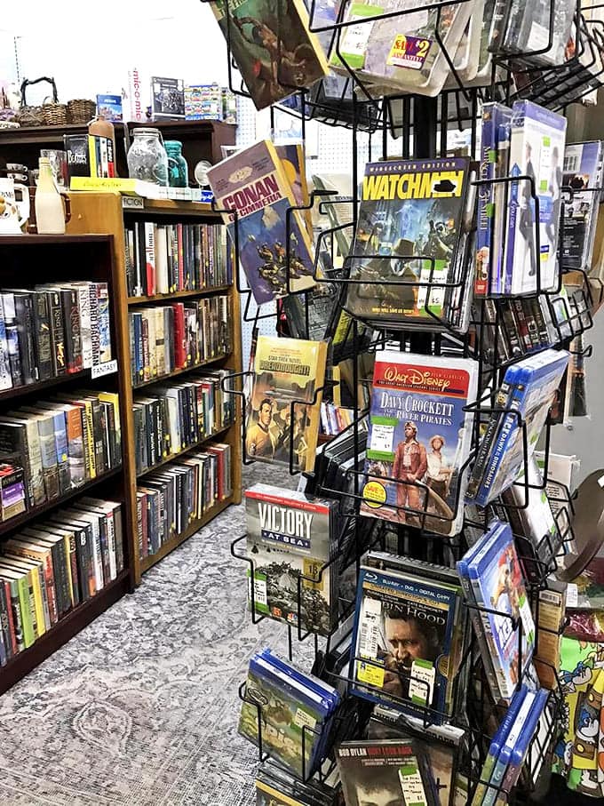 A bibliophile's dream corner where classic films meet vintage books. That Davy Crockett DVD brings back buckskin-fringed memories!
