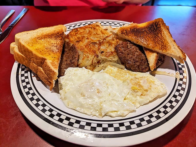 The breakfast of champions—eggs, hash browns, and toast that prove simplicity is the ultimate sophistication when done with decades of practice.