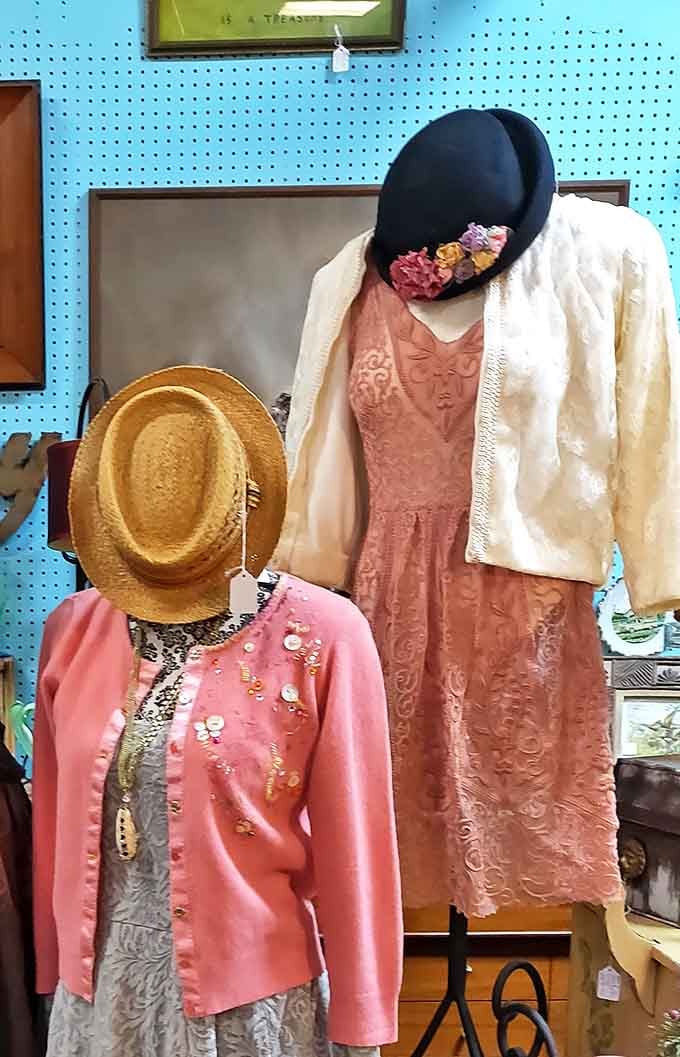 Vintage fashion display featuring delicate lace dresses and structured jackets—proof that style never truly goes out of style.