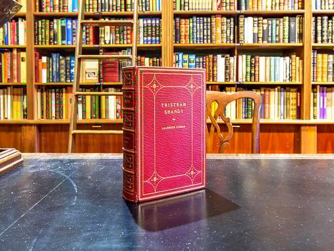 This isn't just a book&mdash;it's literary royalty. The red leather binding and gold embossing of "Tristram Shandy" practically demands white gloves.