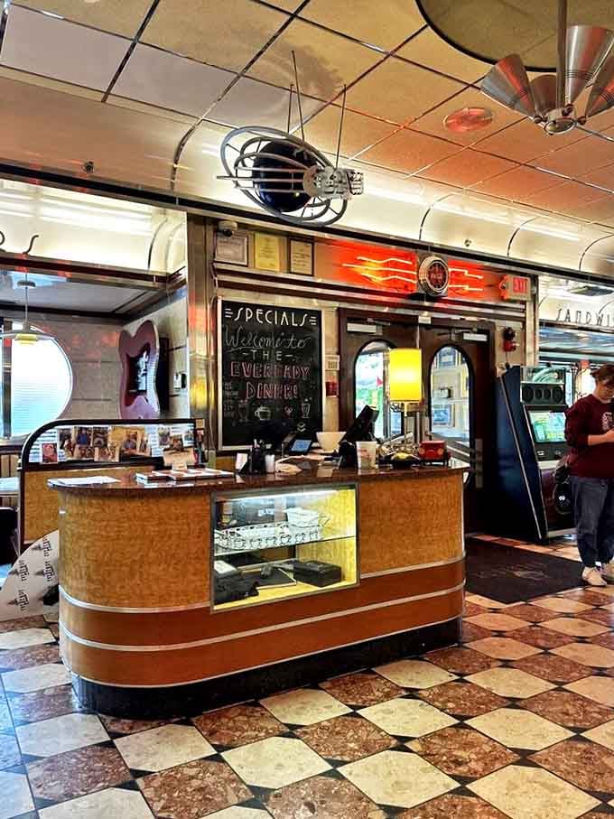 The host station welcomes you like an old friend. That dessert display case is the silent salesperson no one can resist.