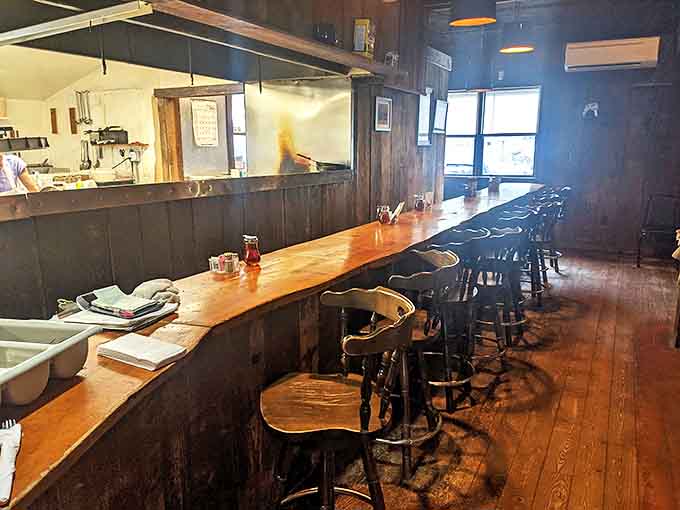Counter seating where regulars exchange local gossip and visitors get the real Vermont scoop. Watch breakfast magic happen while perched on these well-worn stools.