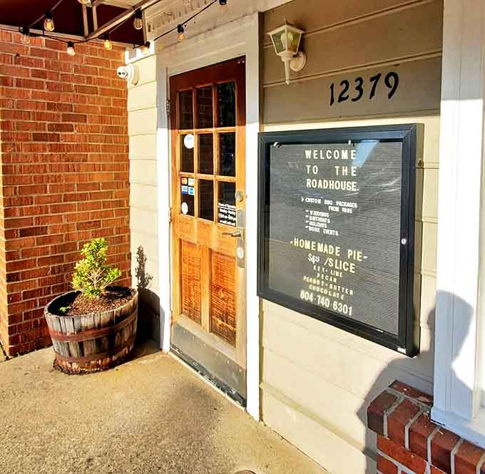 The entrance says "Welcome" twice—once on the sign and once in the warm, unpretentious vibe.