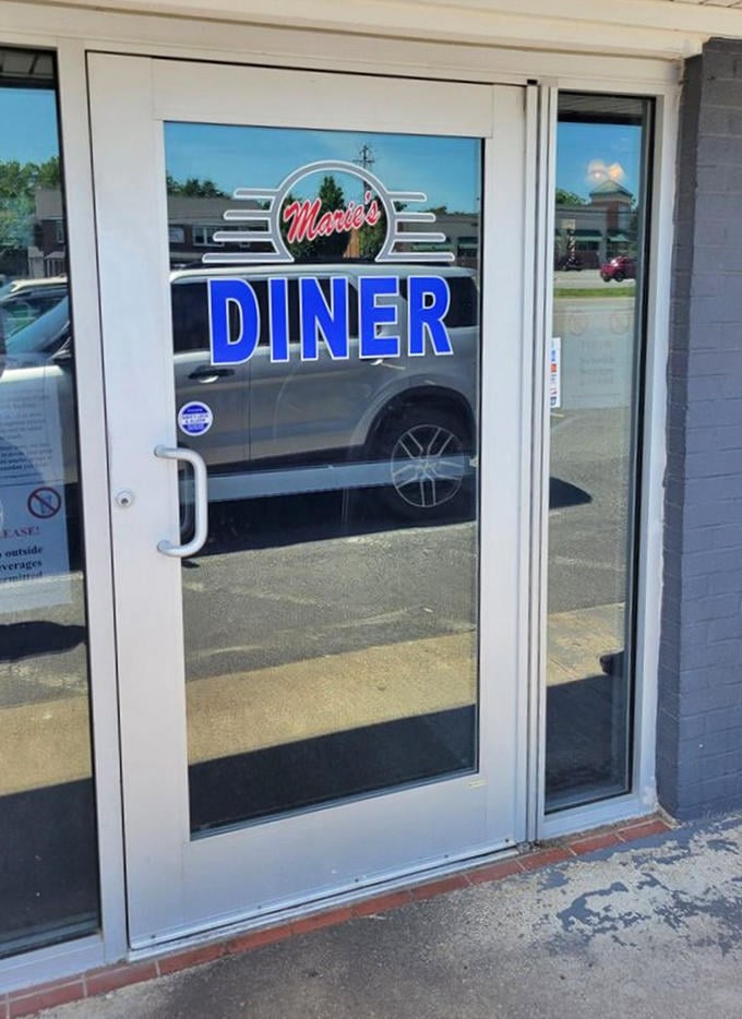 The entrance to Marie's—where diet plans go to die and breakfast dreams come to life in glorious, calorie-laden technicolor.