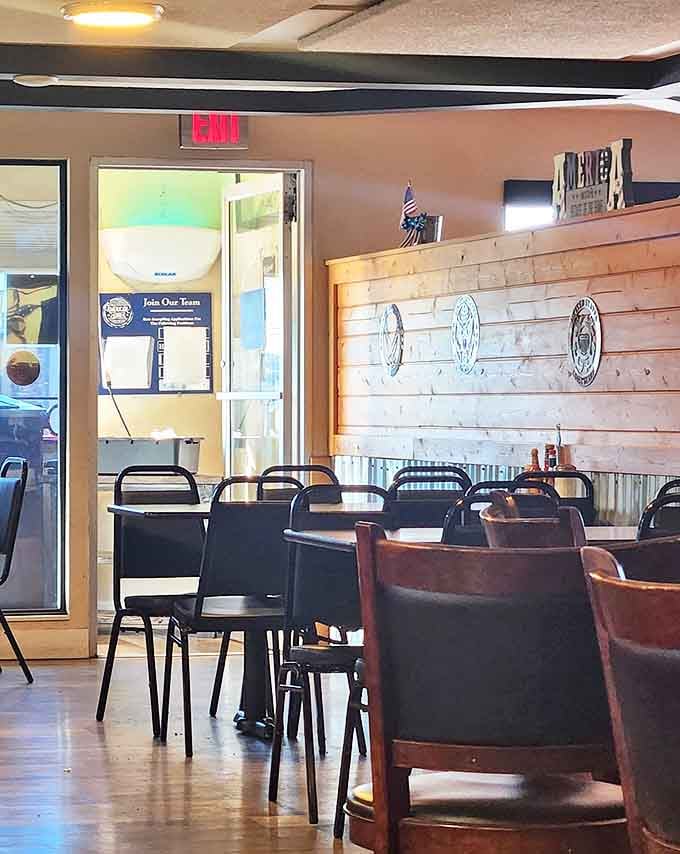 Even the exit feels welcoming, with warm wood tones and a "Please Wait To Be Seated" sign that promises good things come to those who wait.