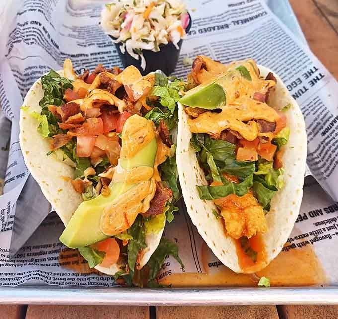 These aren't just tacos&mdash;they're edible love letters to the sea, complete with fresh avocado and a drizzle of sauce that ties it all together.