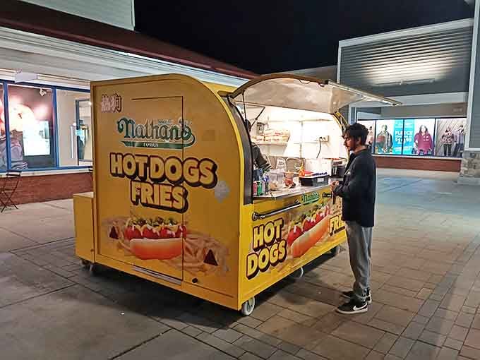 The Nathan's hot dog cart – retail therapy's essential refueling station. Nothing says "I've earned this" like a hot dog between shopping conquests.