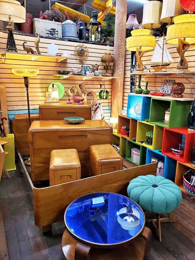 Mid-century magnificence in wood and color! This furniture vignette isn't just selling tables&mdash;it's offering the chance to live inside a 1960s design magazine.