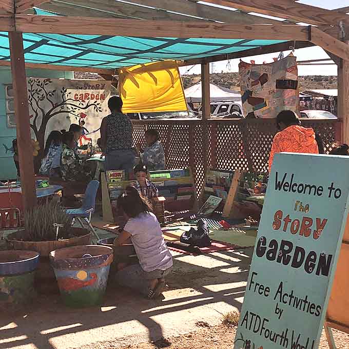 The Story Garden offers a shady oasis where young shoppers can enjoy creative activities while parents hunt for treasures nearby.