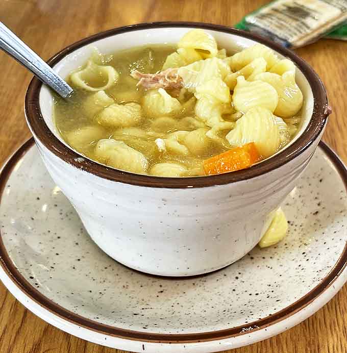 A bowl of homemade chicken noodle soup that tastes like someone's grandmother is back in the kitchen, stirring with a wooden spoon and adding an extra pinch of love.