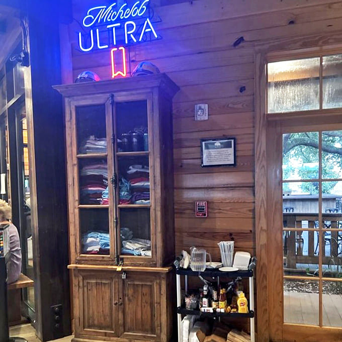 Even the merchandise corner tells a story, with that neon sign casting a blue glow like it's auditioning for a Tennessee Williams play.