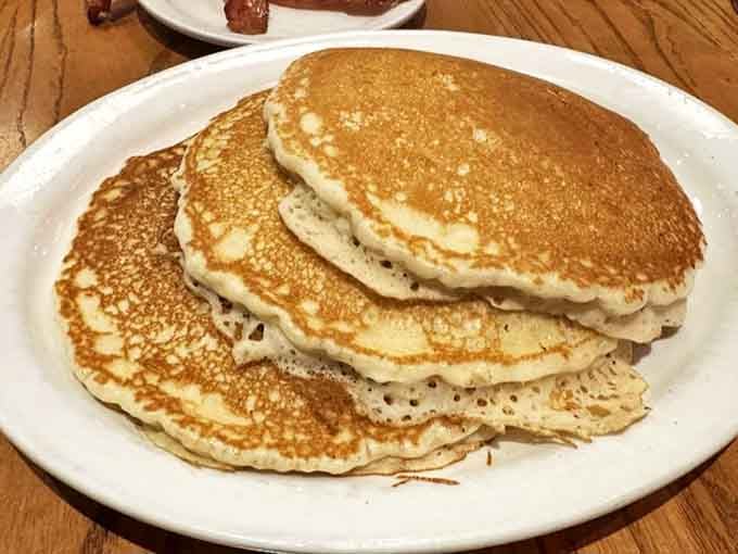 These pancakes don't just sit on the plate&mdash;they command it. Golden-brown, fluffy discs of joy waiting for their maple baptism.