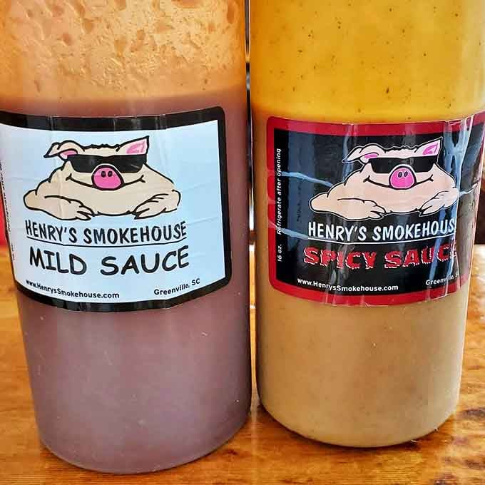 The sauce duo&mdash;mild and spicy&mdash;featuring the restaurant's sunglasses-wearing pig mascot, ready to elevate your barbecue experience to new heights.