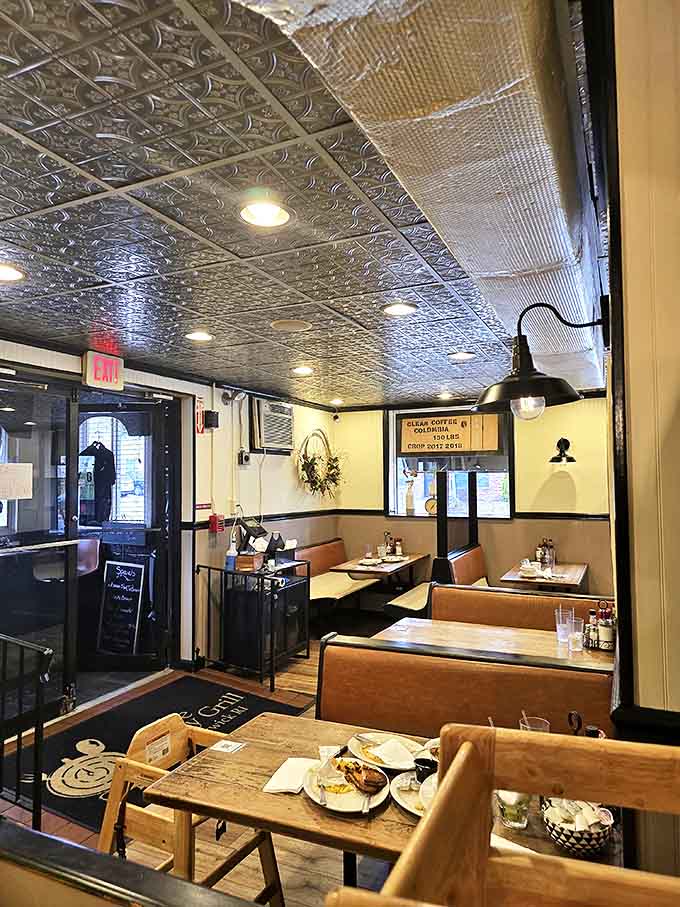 Cozy indeed&mdash;these booths invite you to settle in, take your time, and maybe order that second cup of coffee. The pressed tin ceiling adds vintage charm to every bite.