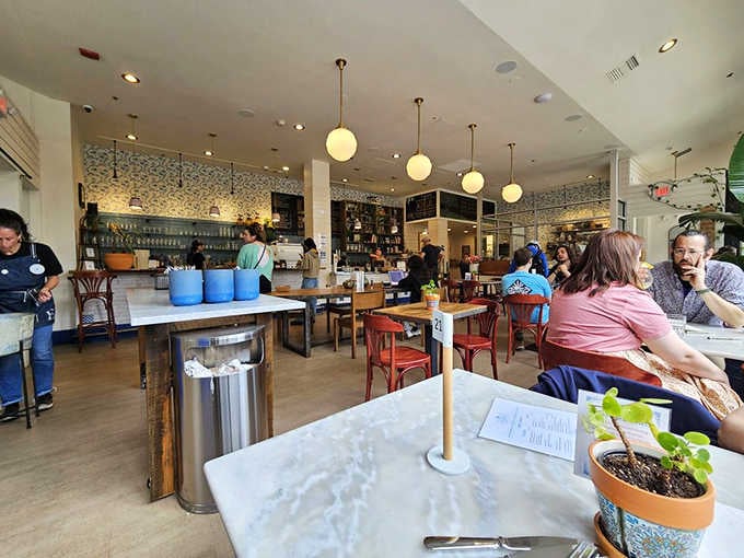 The dining room buzzes with conversation and coffee sipping&mdash;a community gathering spot where strangers become neighbors over pastries.