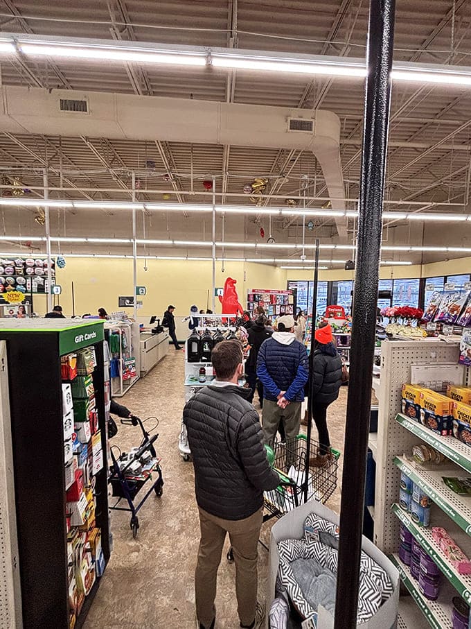 The checkout line: where strangers bond over their shared triumph of stretching dollars further than physics should allow.