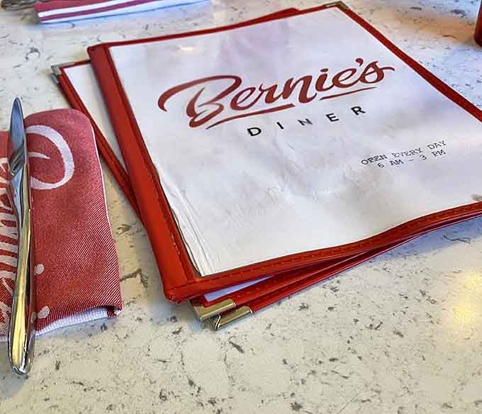 The menu cover promises "OPEN EVERY DAY"—three beautiful words that mean comfort food is always within reach.