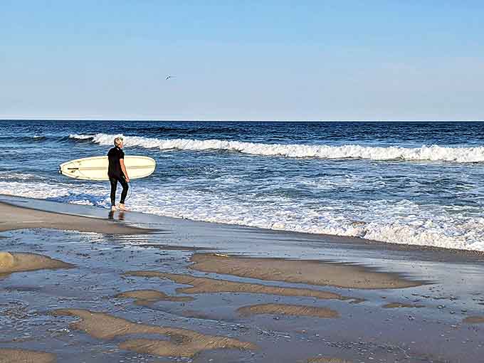 The eternal dance between surfer and wave plays out on Robert Moses' shores, a timeless ritual of patience, timing, and occasional spectacular wipeouts.