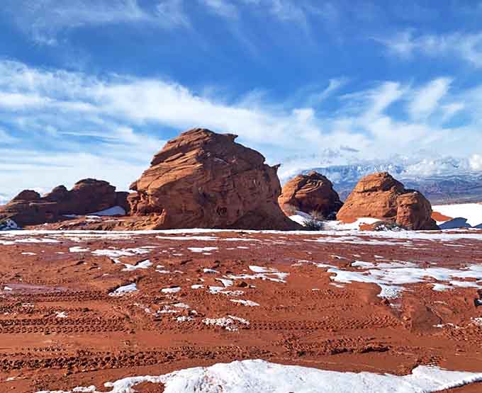 Winter's gentle touch transforms the red rock playground into a serene snow-dusted meditation space.