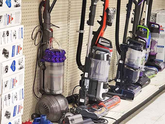 Vacuum cleaners lined up like soldiers ready to battle dust bunnies without waging war on your wallet—household heroes at half the price.