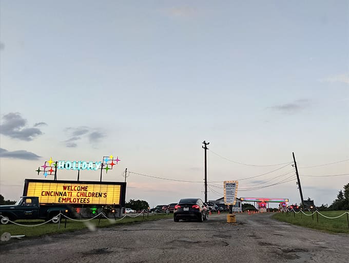 As dusk settles, the marquee lights up with welcome messages, turning an ordinary field into a community gathering place.